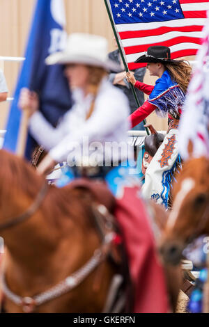 Rodeo Queen riding with the American flag at the Pro Rodeo in Enumclaw ...