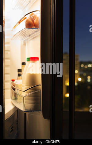 Refrigerator door open at night Stock Photo - Alamy