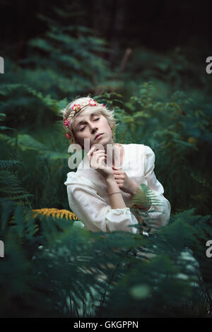 Beautiful young fairytale nymph girl in natural dress in sacred river ...