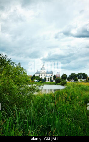 monastery on lake at evening Stock Photo - Alamy