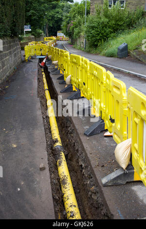 Gas pipes being replaced in road Stock Photo - Alamy