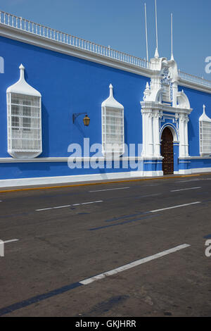 Bright blue and white Spanish colonial style building in the Plaza de ...