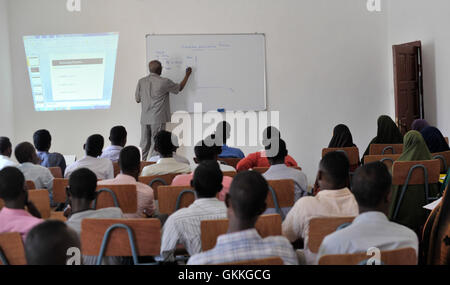 Somali lecturer gives lesson to his students in the class at the Somali ...