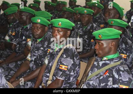 A group of newly deployed Ugandan police officers pose for a photo ...
