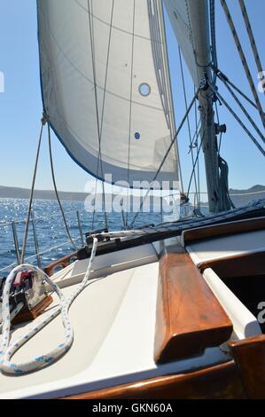 Man setting sail on his boat Stock Photo - Alamy