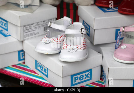 Pex shoes for young children in a shop window Stock Photo - Alamy