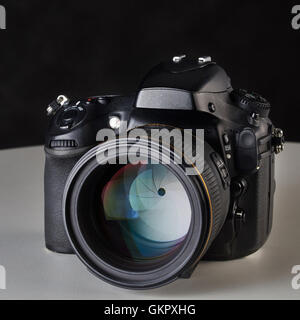 DSLR camera with big aperture ratio lens on black Stock Photo - Alamy