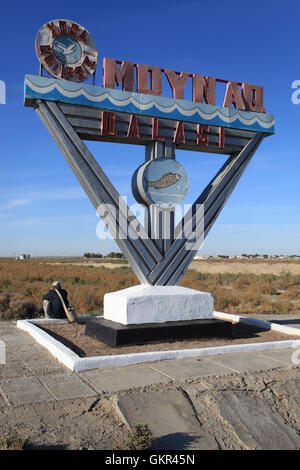 Entrance sign to Moynak with a depicted fish, Uzbekistan Stock Photo ...