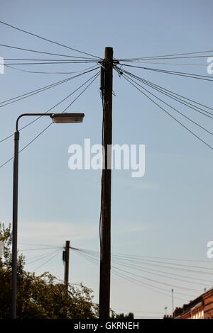 overhead telephone lines from wooden telegraph pole distribution point ...