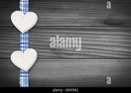 Two hearts laying on wood Stock Photo - Alamy