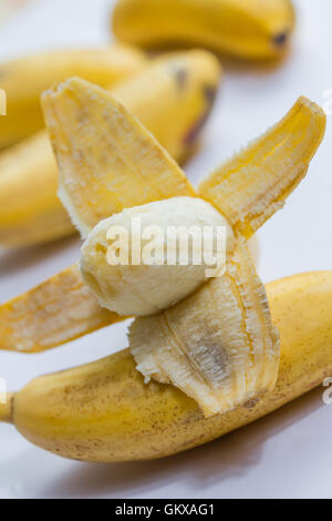 Mini bananas isolated on a white background Stock Photo - Alamy