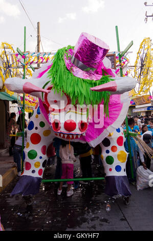 Giant cardboard bull (torito) with fireworks parading during the ...