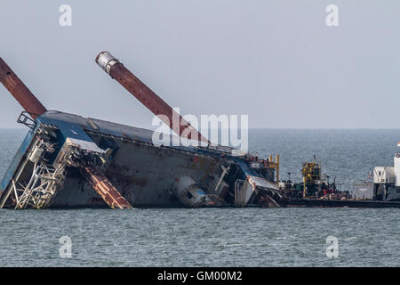 The capsized offhore wind rig SEA WORKER off Nymindegab at the Danish ...