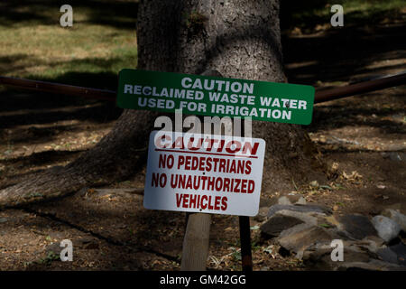 Sign on golf course reclaimed water use for irrigation. California. USA ...
