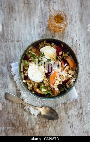 Hearty oat flakes bowl with fruits, goat cheese and thyme Stock Photo ...