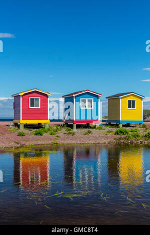 Colorful fishing stages with reflections at Cavendish, Newfoundland and ...