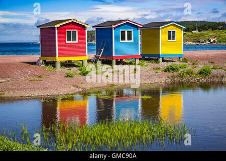 Colorful fishing stages with reflections at Cavendish, Newfoundland and ...