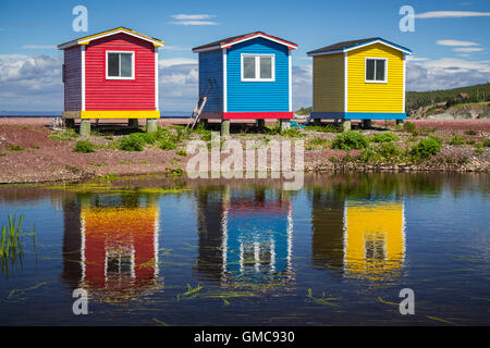 Colorful fishing stages with reflections at Cavendish, Newfoundland and ...