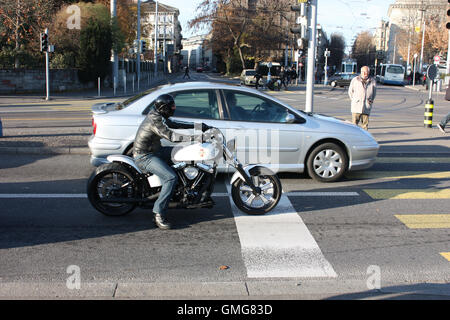 A man with a motorcycle is standing at the intersection Stock Photo - Alamy