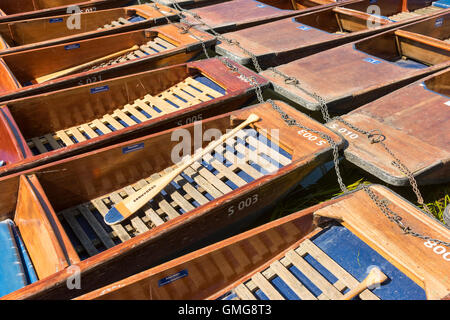 A closeup view of wooden punts moored up at the "Head of the River" in ...