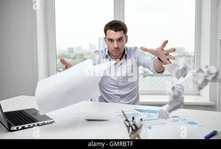 angry businessman throwing papers in office Stock Photo - Alamy