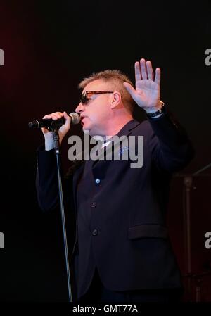 Suggs, lead singer of British ska group Madness, performing at Party in ...