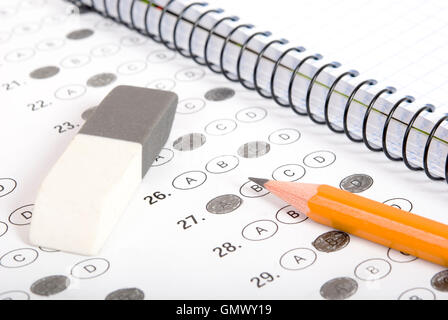 Test score with pencil, notebook and eraser Stock Photo - Alamy