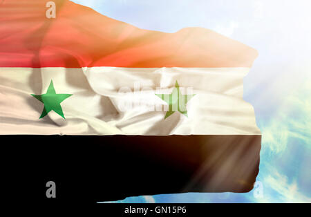 Syria waving flag against blue sky with sunrays Stock Photo - Alamy
