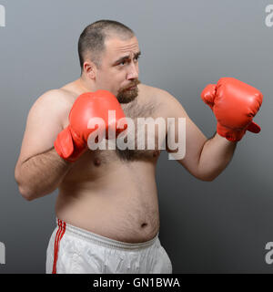 Portrait of funny fat boxer against gray background Stock Photo - Alamy