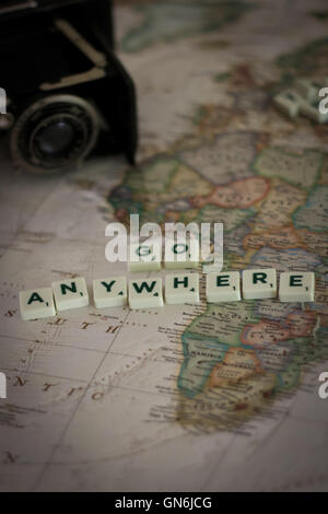 World map with words and quote using lettered tiles Stock Photo - Alamy