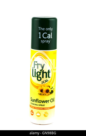 Spray bottle with cooking oil, sunflower and seeds on white background ...