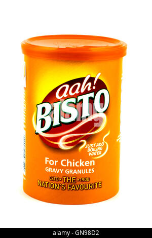 A tub of Bisto chicken gravy granules next to a freshly cooked whole ...