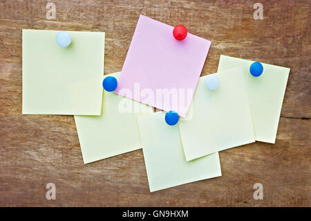 A piece of paper pinned the button Stock Photo - Alamy