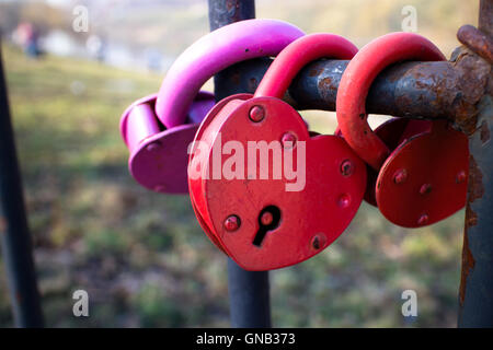 closed red and pink heart-shaped cardboard boxes on a pink background ...