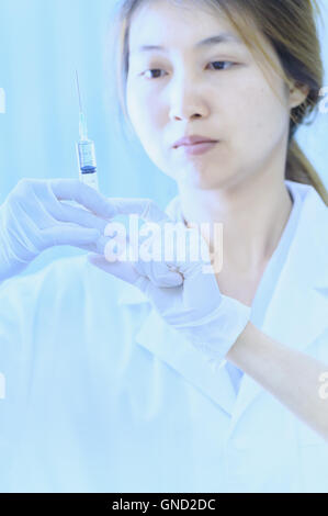 doctor using a syringe Stock Photo - Alamy