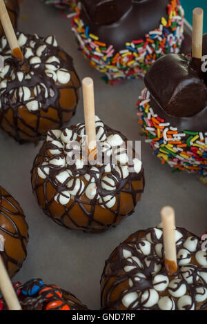 Tray of assorted variety of candy apples at state fair Stock Photo - Alamy