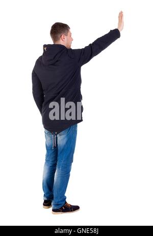 Back view of beautiful man welcomes. man hand waving from. Rear view ...