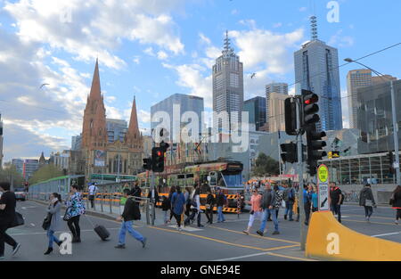 People cross a street in a downtown area of Sapporo in Hokkaido ...