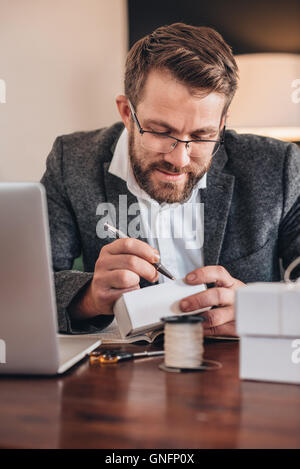Successful businessman inside the office reading a financial report ...