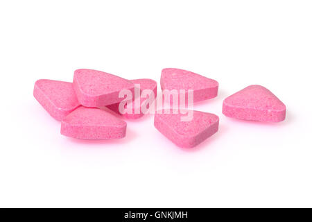 some pink painkiller pills on white background Stock Photo - Alamy