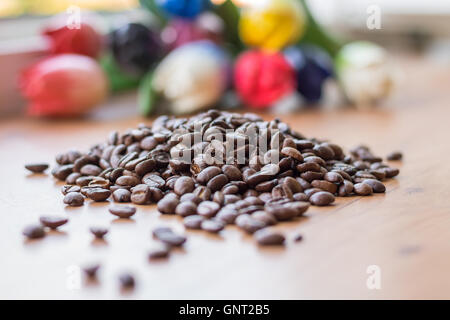 Small handful lot of brown roasted coffee beans Stock Photo - Alamy