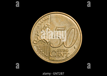coins lie on a black background close up Stock Photo - Alamy