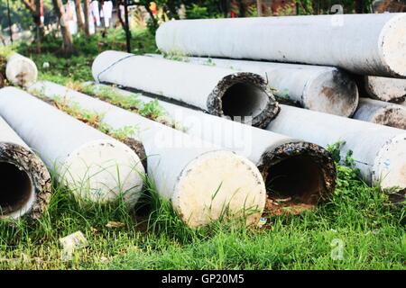 Concrete construction tube pipe. Building a road sewer drain system ...