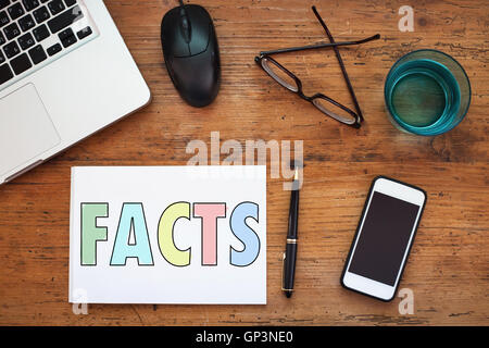 The word FACTS concept written in colorful fragmented word art on a ...