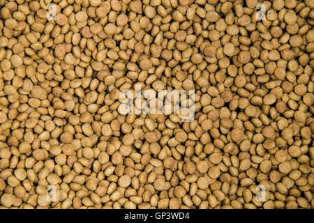 Dry pet food texture background. Food for cats and dogs pattern. Pile ...