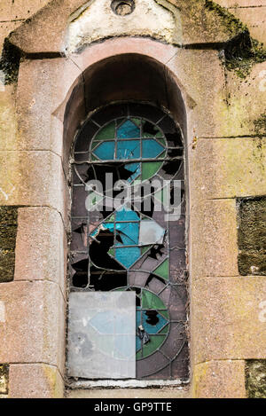 Broken stained glass window in an abandoned church Stock Photo - Alamy