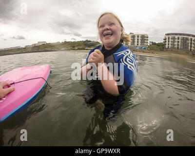 Wide angle GoPro image of girl on surf board Stock Photo - Alamy