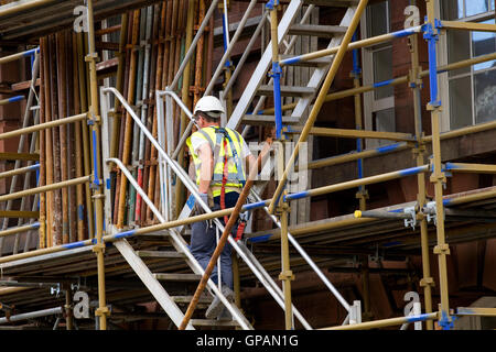 A workman detaching the scaffolding from the DC Thomson Newspaper ...