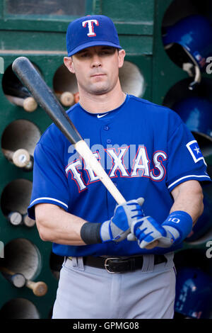 Texas Rangers third baseman Michael Young is unable to grab a ground ...