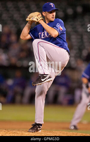 Texas Rangers relief pitcher Chris Martin winds up to deliver to the Houston Astros during a ...